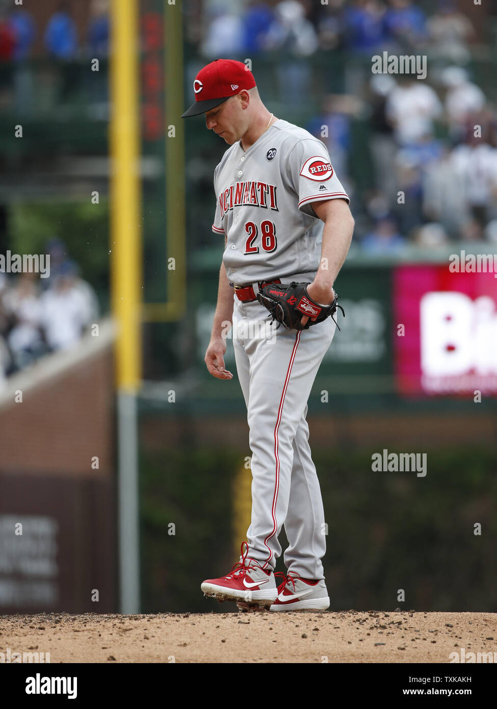 Cincinnati Reds starting pitcher Anthony DeSclafani reacts after giving ...