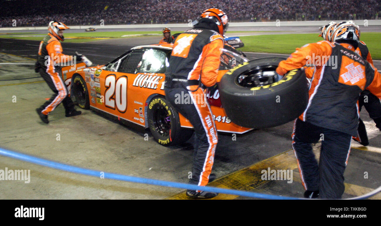 The Home Depot pit crew works onTony Stewart's race car during a ...