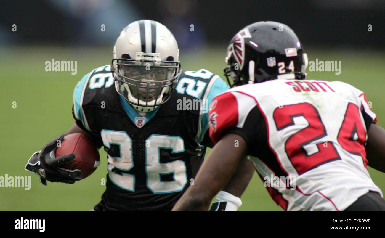 DeShaun Foster (26) running back for the Carolina Panthers takes on ...
