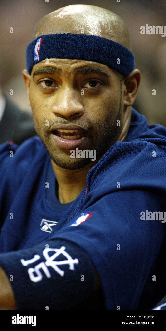New Jersey Nets guard Vince Carter watches his team play the Charlotte ...