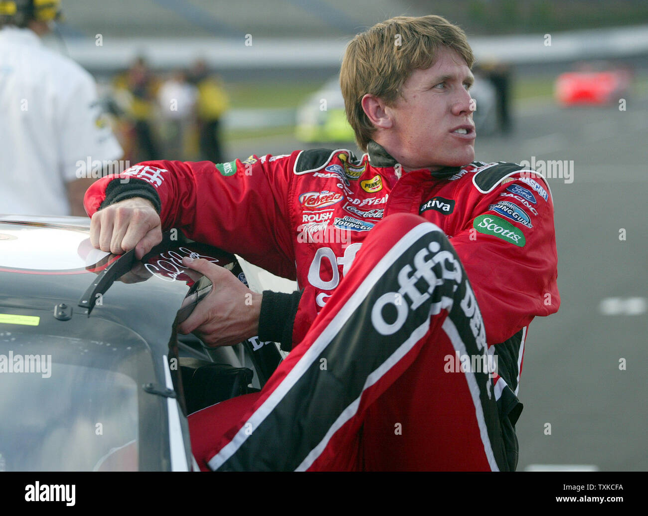 Race car driver Carl Edwards climbs out of the Office Depot Ford after ...