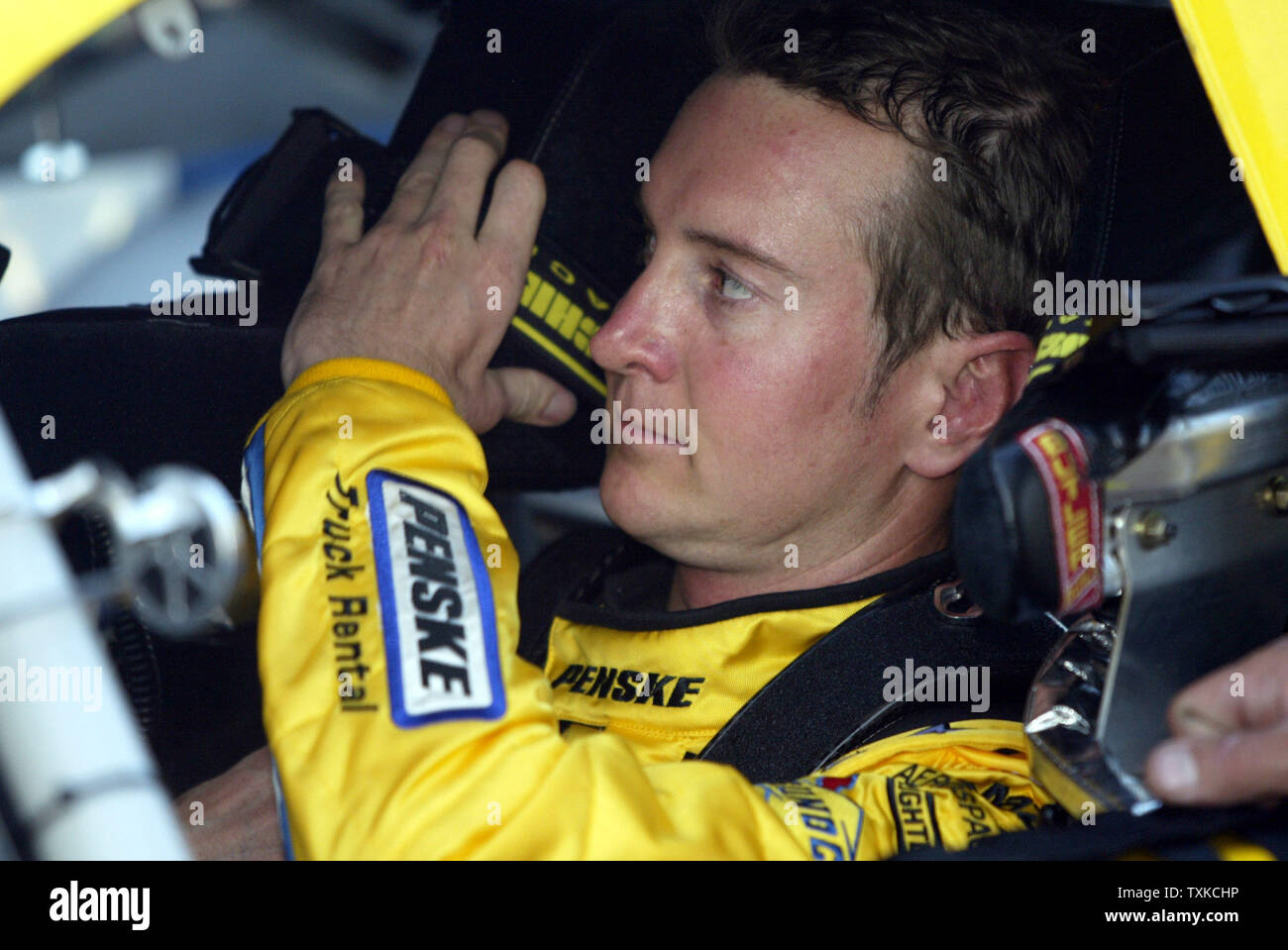 Race car driver Kurt Busch straps into his race car before the start of ...