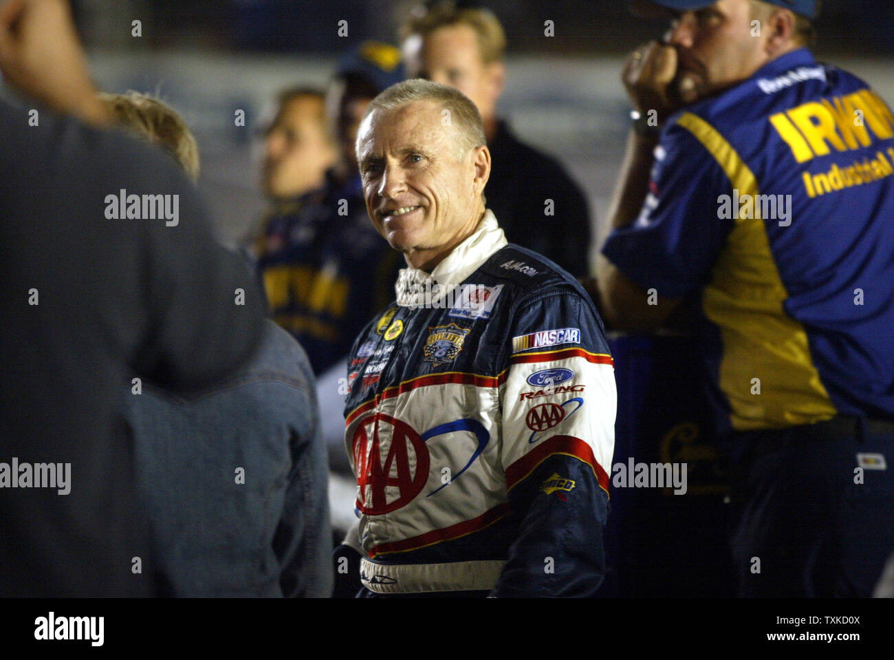 NASCAR driver Mark Martin stands on pit road during qualifying for the ...