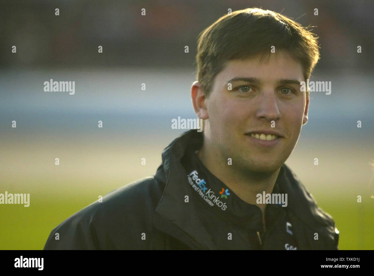 Race car driver Denny Hamlin stands on pit road before the start of the ...