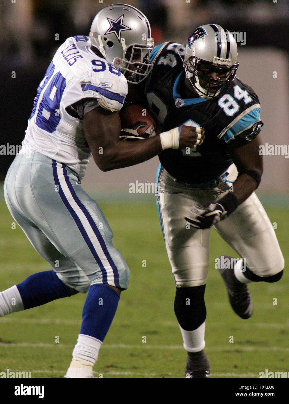 Carolina Panthers tight end Michael Gaines (84) fights off a tackle by ...