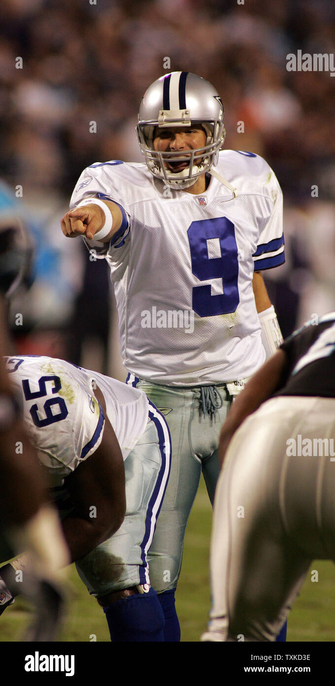 Dallas Cowboys quarterback Tony Romo (9) points to a shift made by the ...