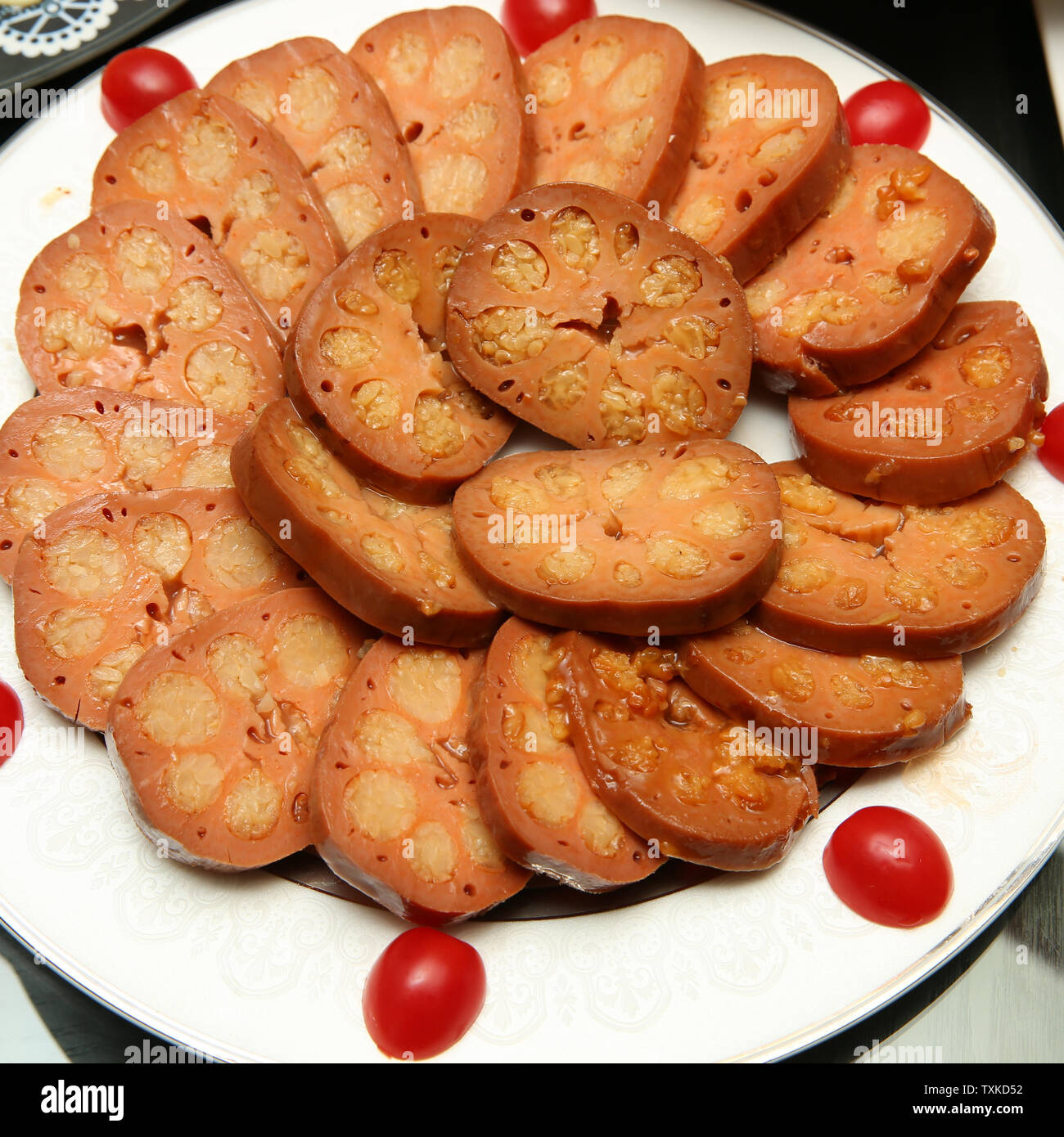 Sweet and sour lotus root slices Stock Photo - Alamy