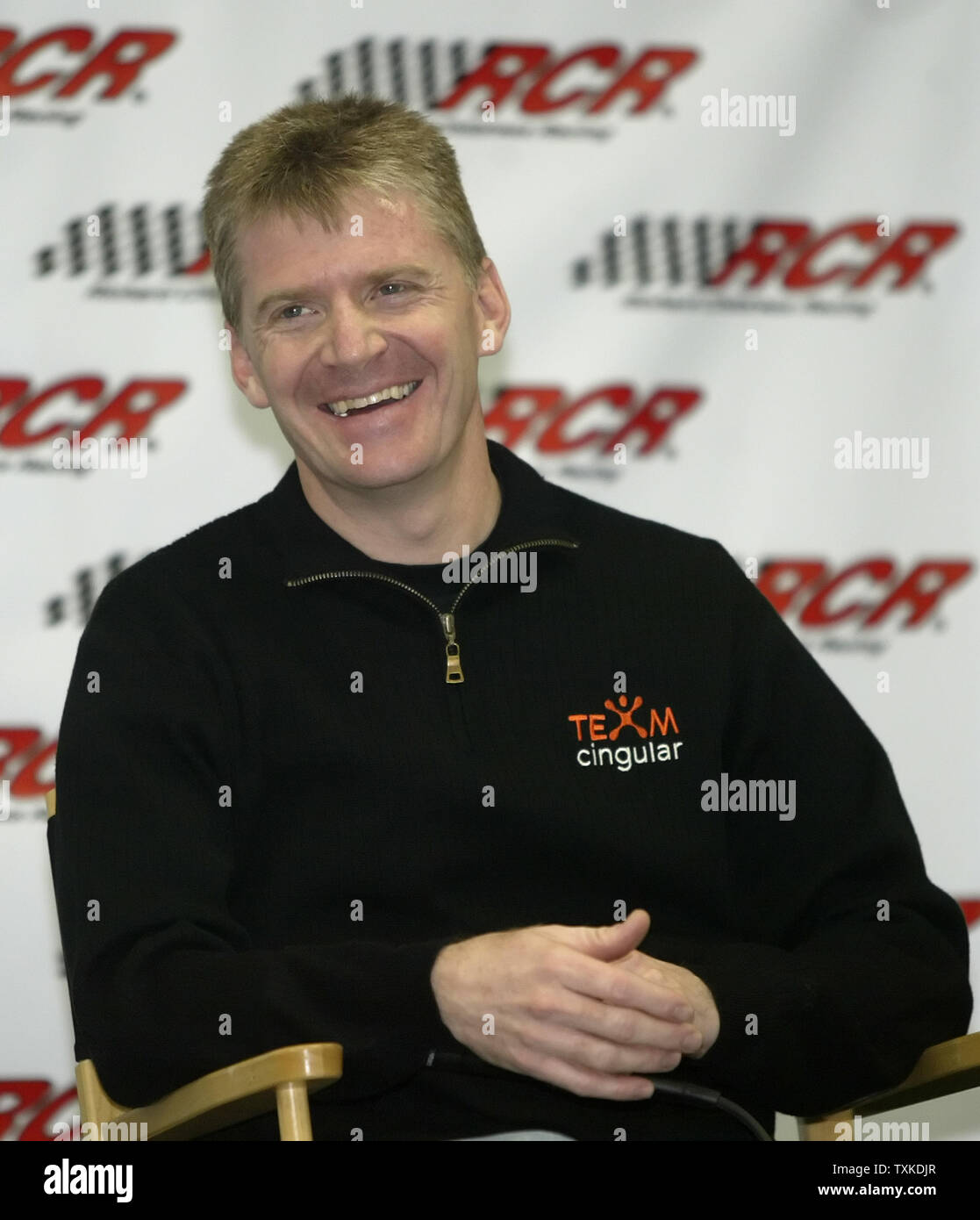 NASCAR driver Jeff Burton laughs during a press conference at the ...