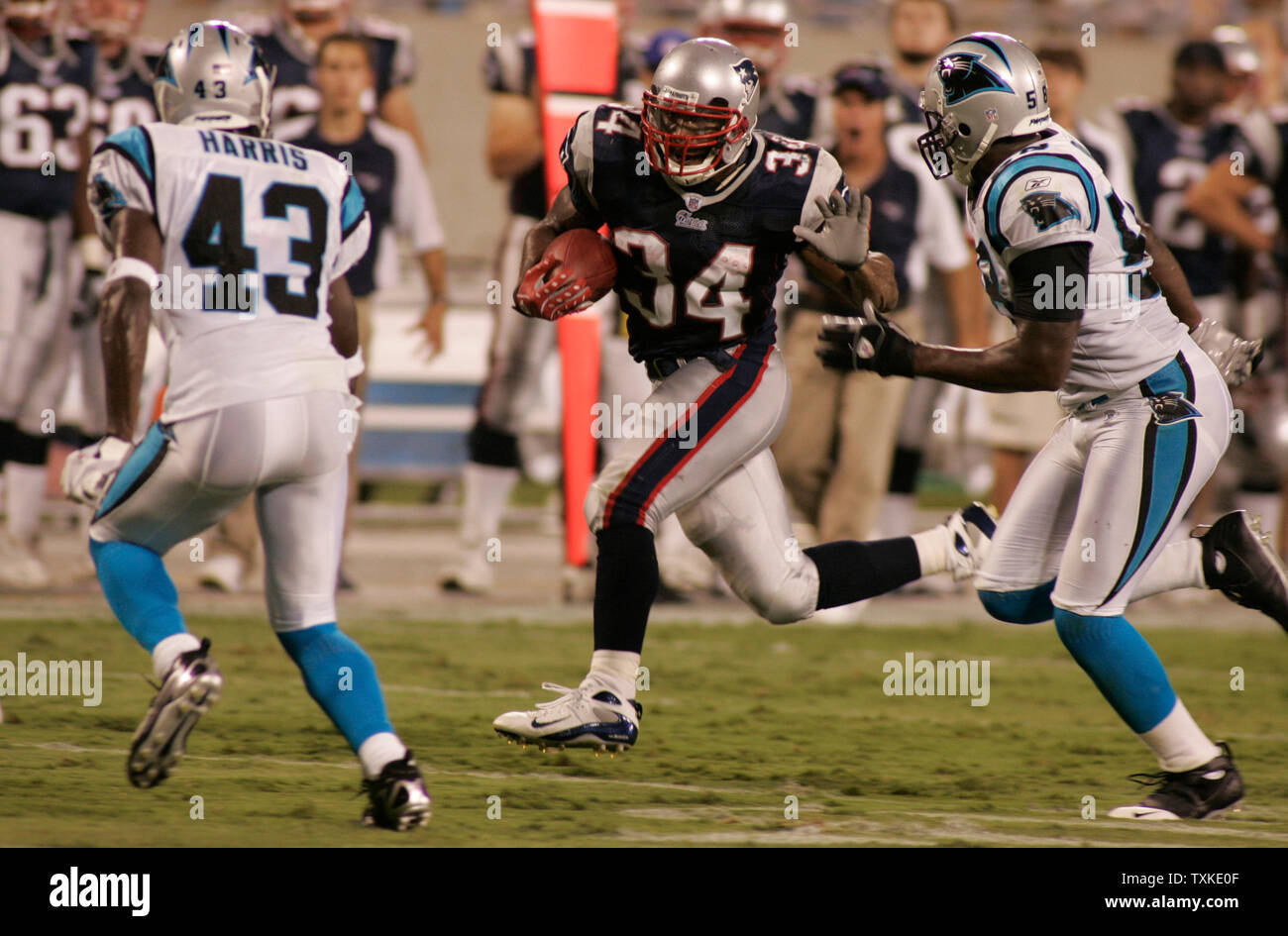 New England Patriots running back Sammy Morris (34) eludes Carolina ...