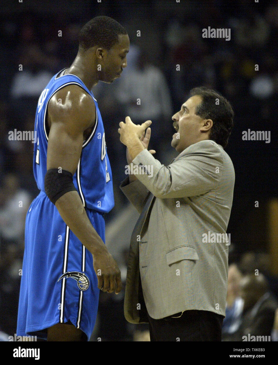 Orlando Magic forward Dwight Howard, left, listens to head coach Stan ...