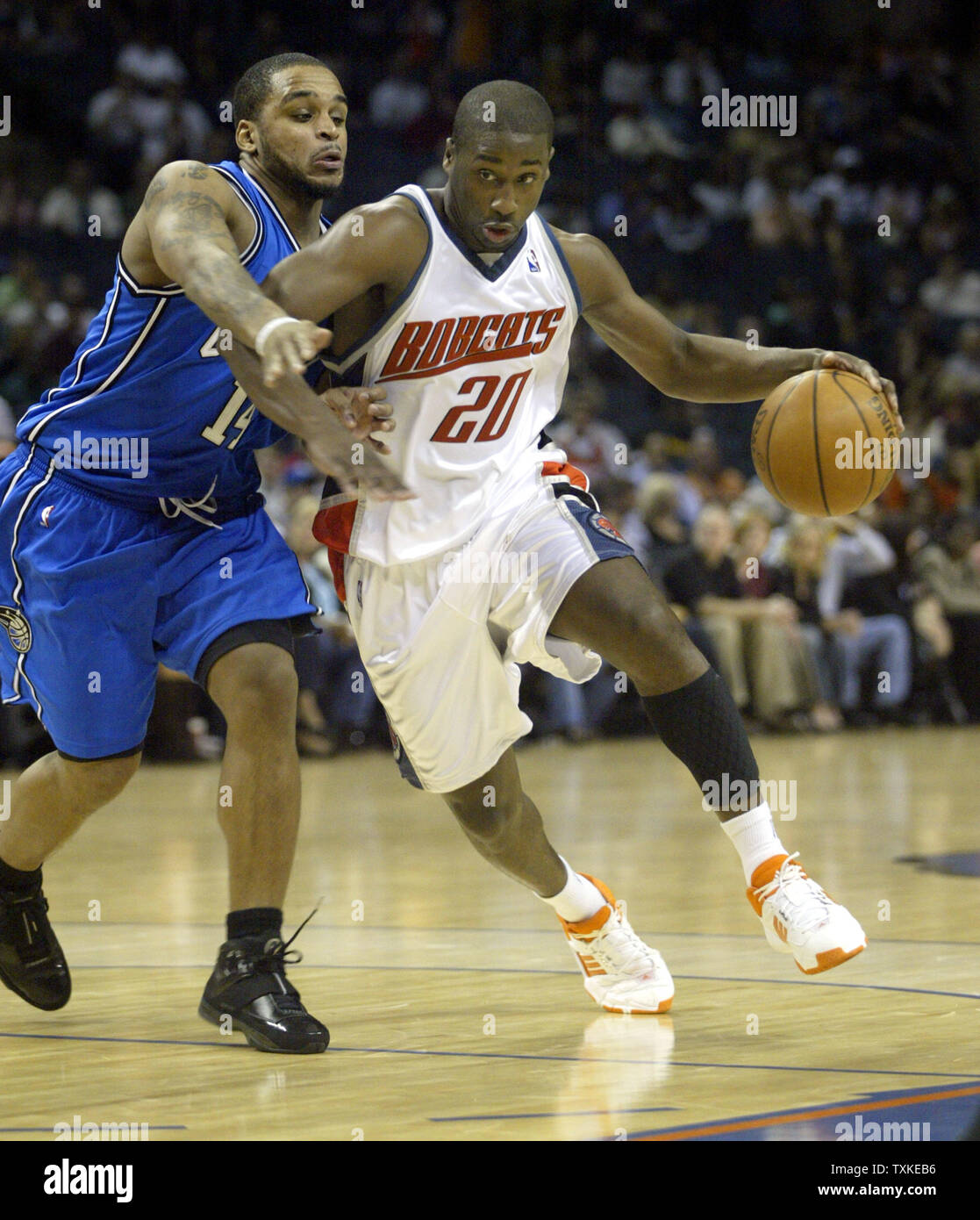 Charlotte Bobcats guard Raymond Felton, right, drives against Orlando ...