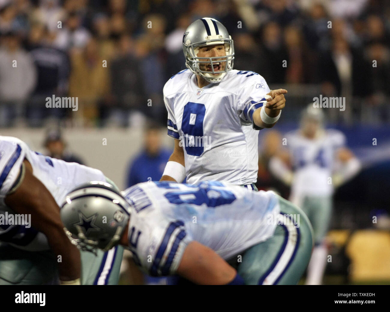 Dallas Cowboys quarterback Tony Romo calls a play at the line of ...