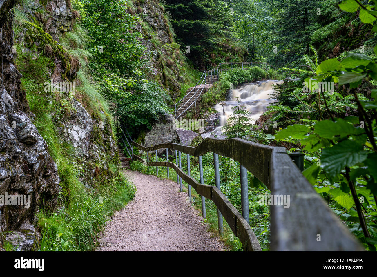 waterfall with bridge at Allerheiligen waterfall cascade in black ...