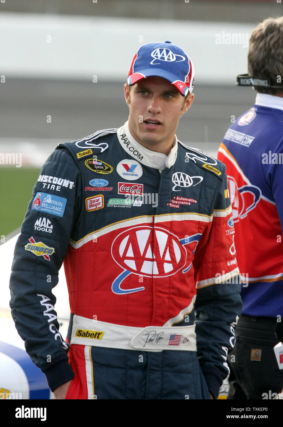 NASCAR driver David Ragan stands by his car on pit road during ...