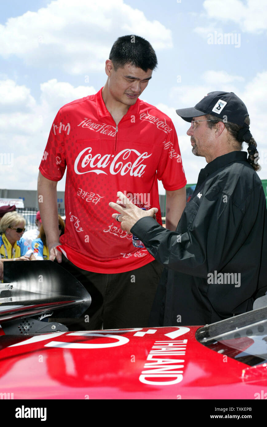 NASCAR driver Kyle Petty, right, talks to Houston Rockets center Yao ...