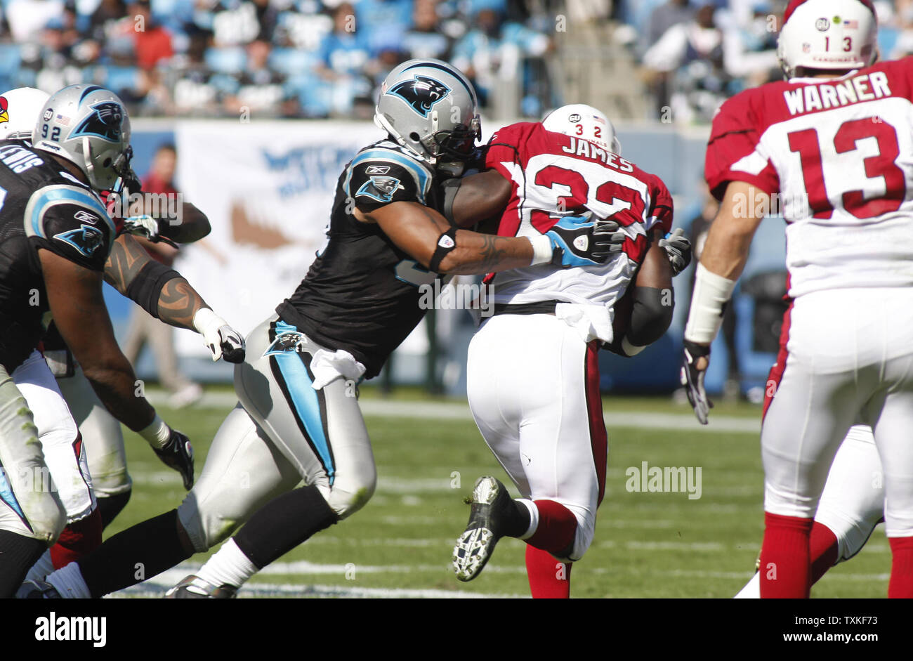 Carolina Panthers defensive end Julius Peppers (90) wraps up Arizona ...