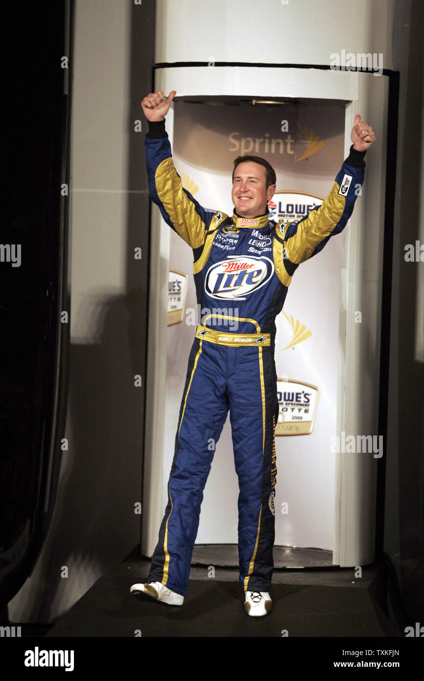 Race car driver Kurt Busch waves to fans during driver introductions ...
