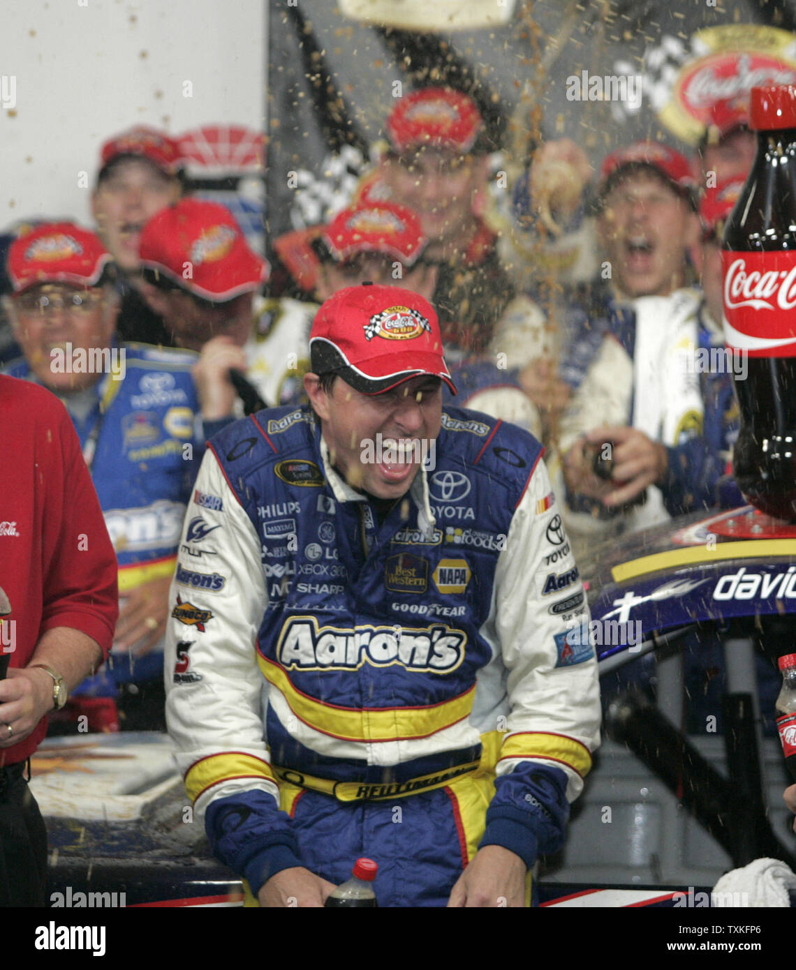Race car driver David Reutimann celebrates in victory lane after ...