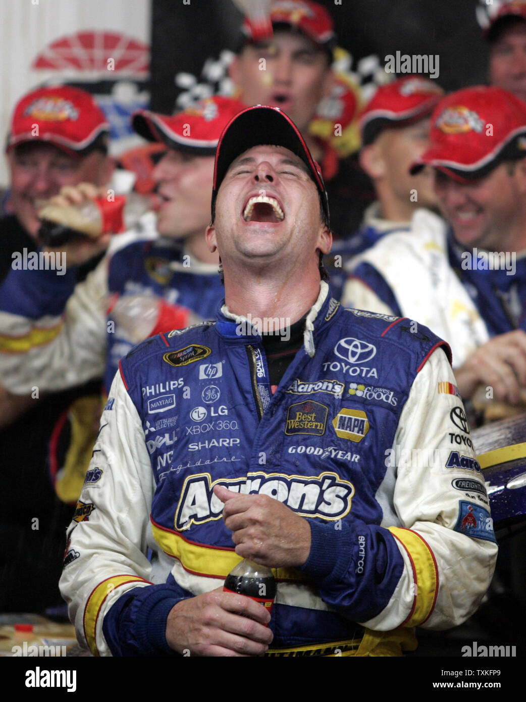 Race car driver David Reutimann celebrates in victory lane after ...