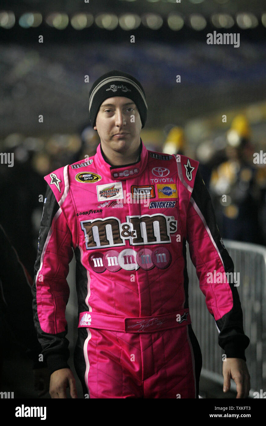 Nascar driver Kyle Busch walks to his car before the start of the ...