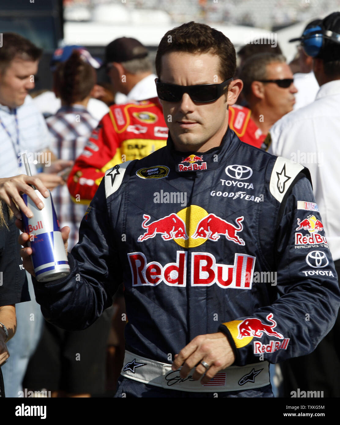 Race car driver Casey Mears walks through the pits before the start of ...