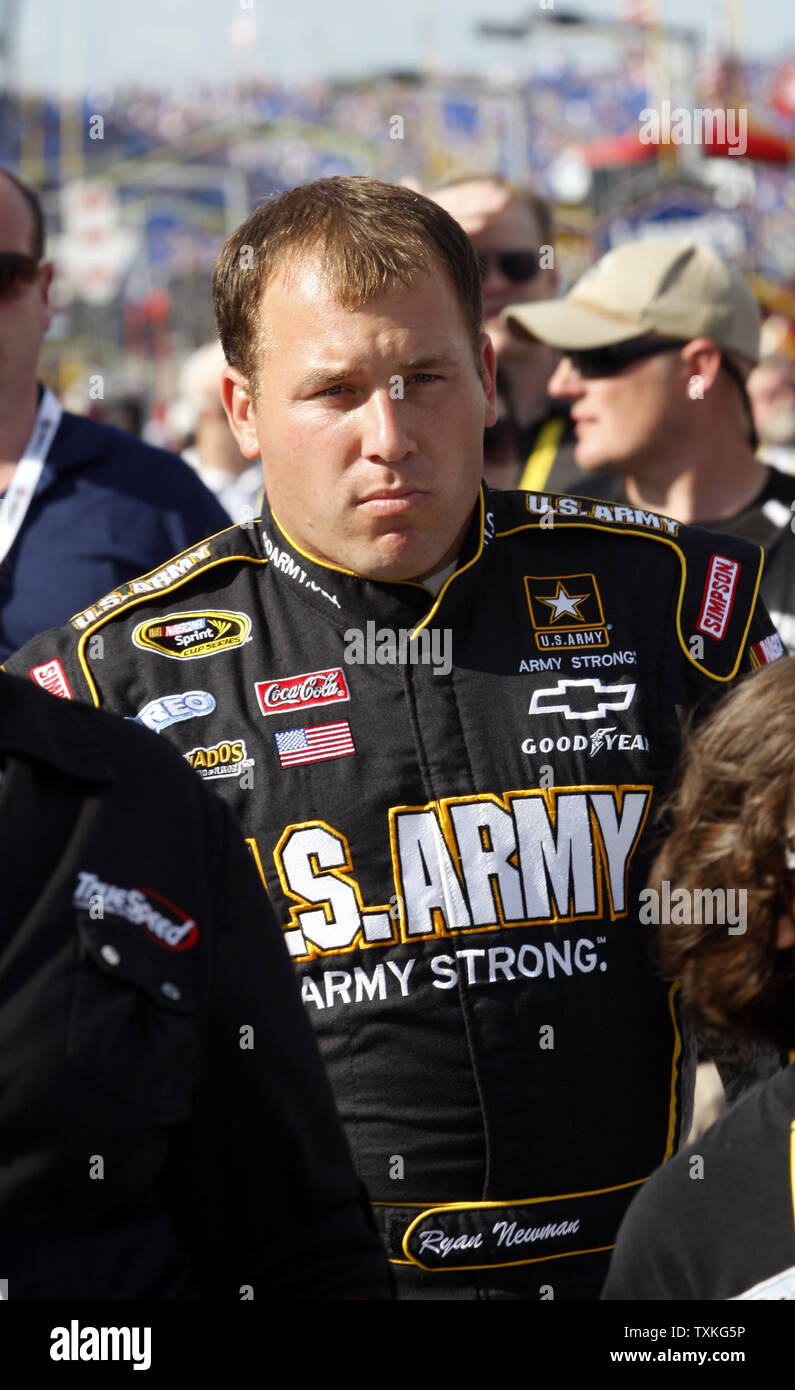 Race car driver Ryan Newman walks through the pits before the start of ...