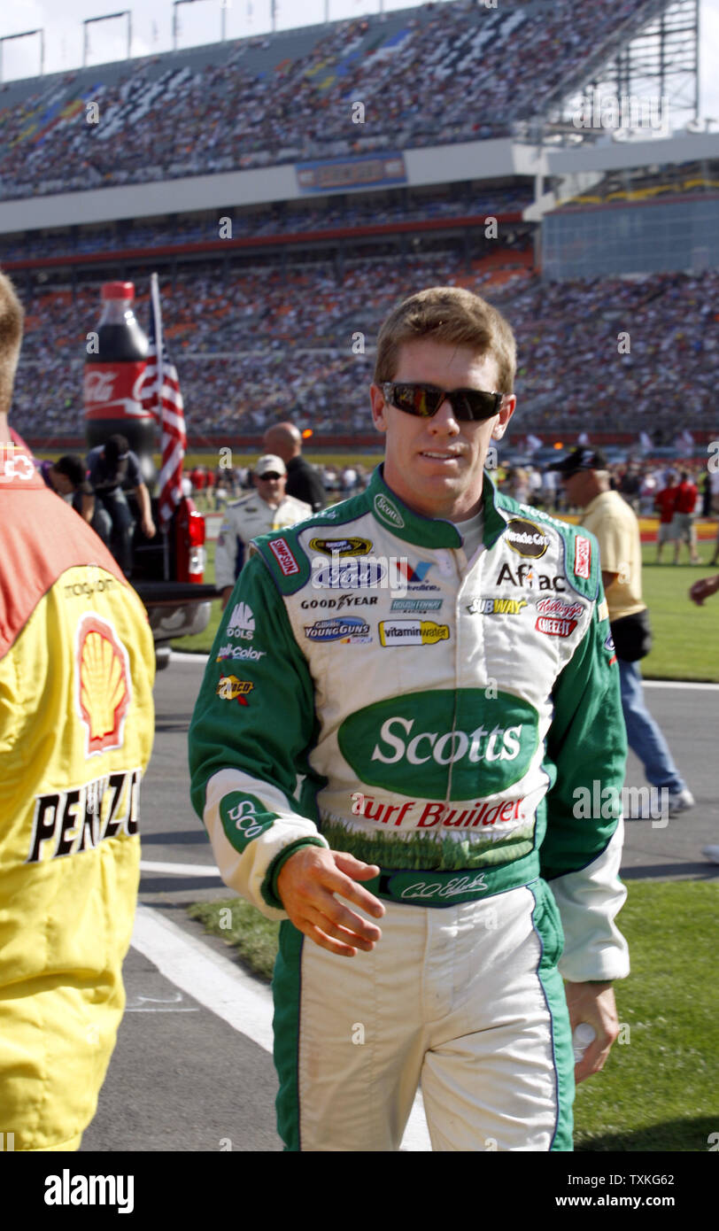 Race car driver Carl Edwards heads to his car before the start of the ...