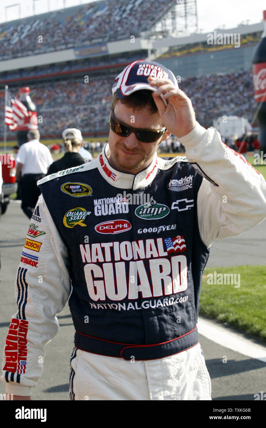 Race car driver Dale Earnhardt Jr. walks to his car before the start of ...