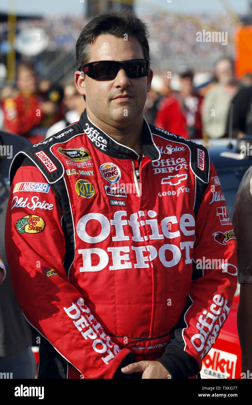 Race car driver Tony Stewart awaits the start of the NASCAR Coca-Cola ...