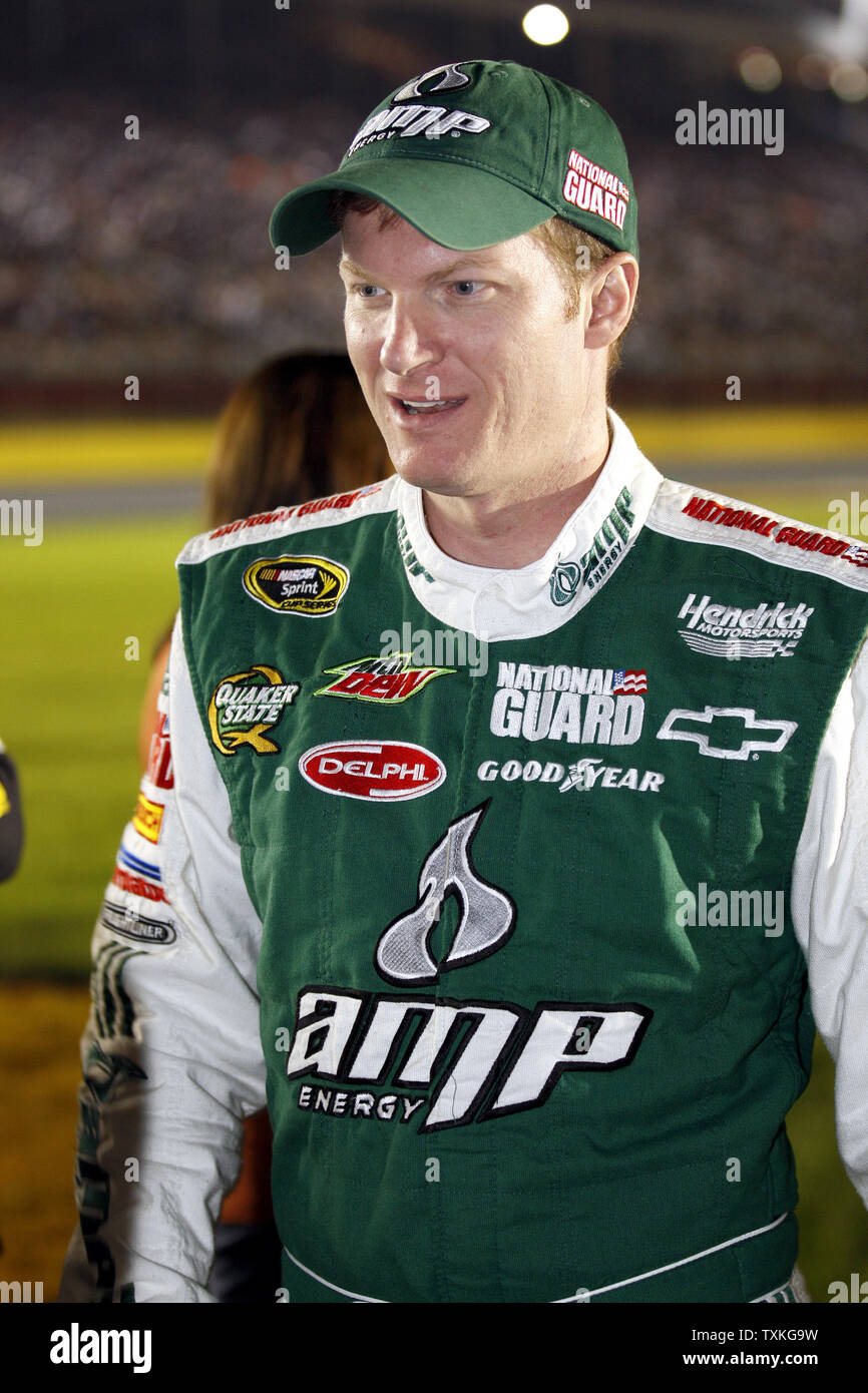 Race car driver Dale Earnhardt Jr. stands on pit road before the start ...