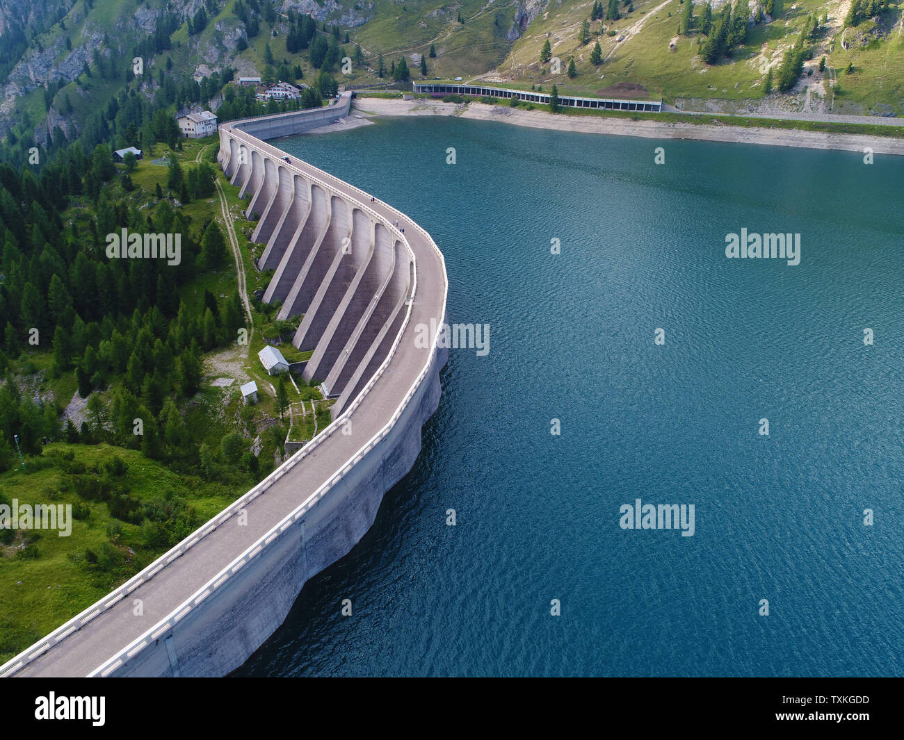 Dam And Mountain Lake At The Fedaia Pass Stock Photos & Dam And ...