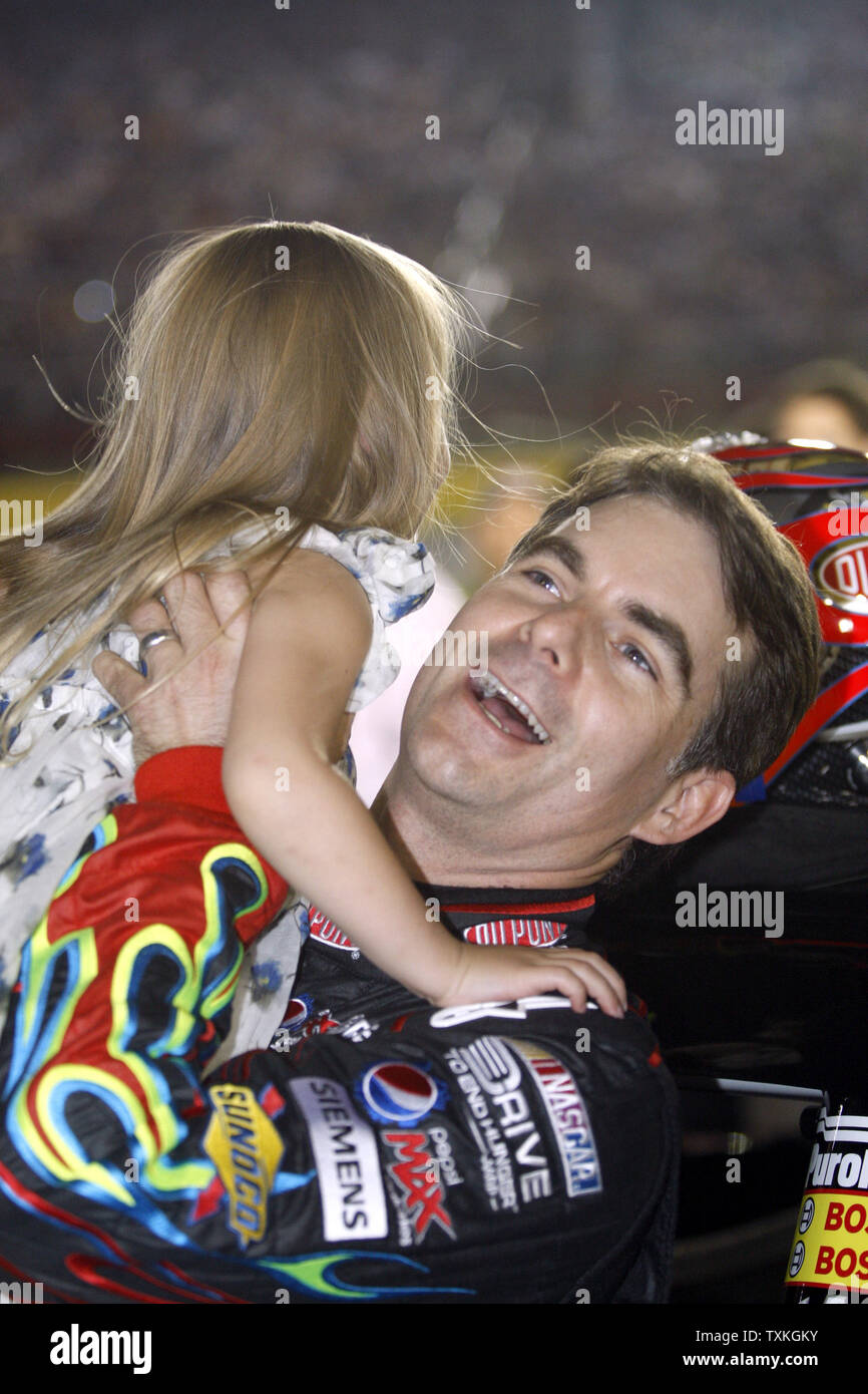 Jeff Gordon holds his daughter Ella Sophia on pit road before the ...