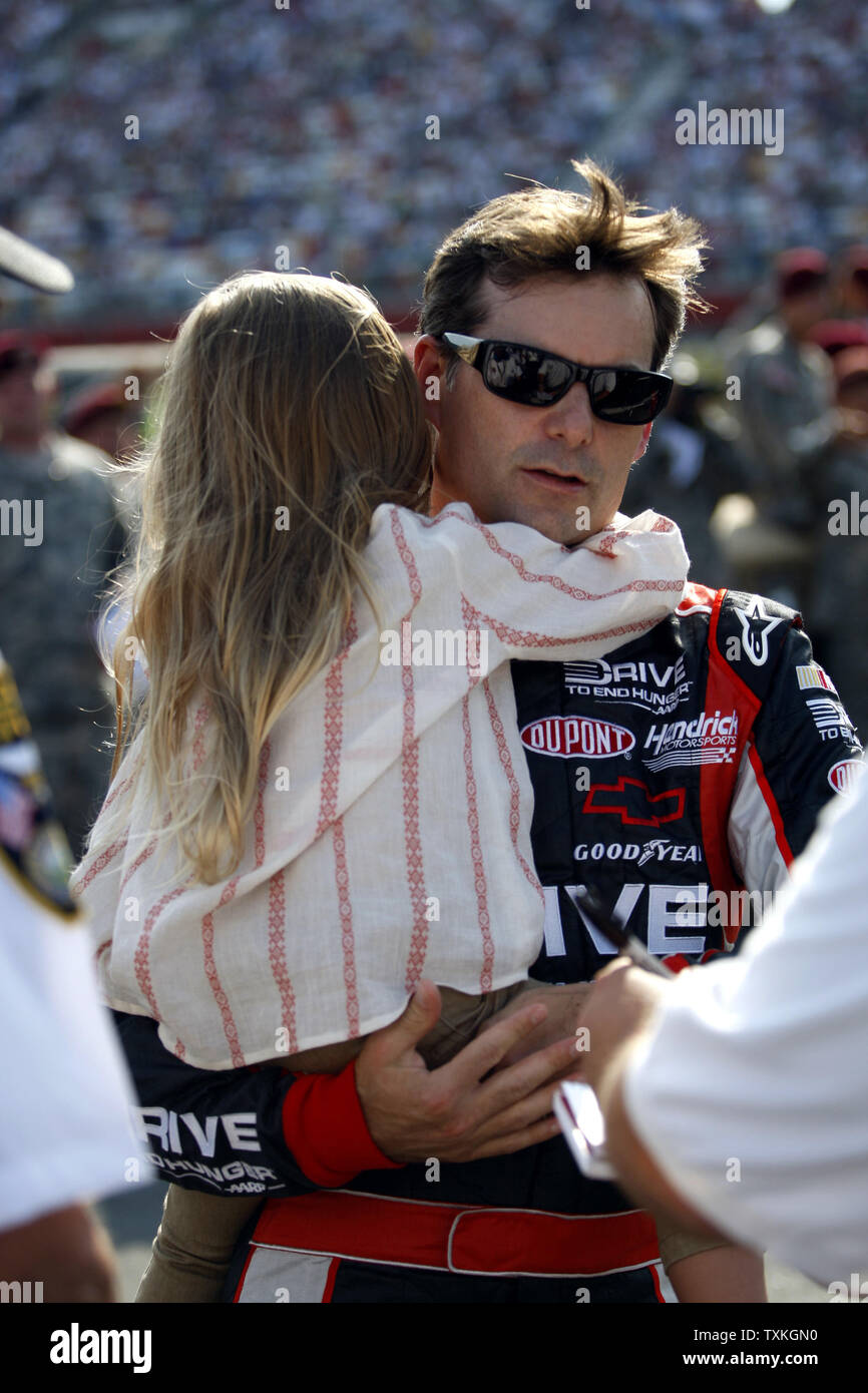 Race car driver Jeff Gordon holds his daughter Ella Sophia Gordon on ...