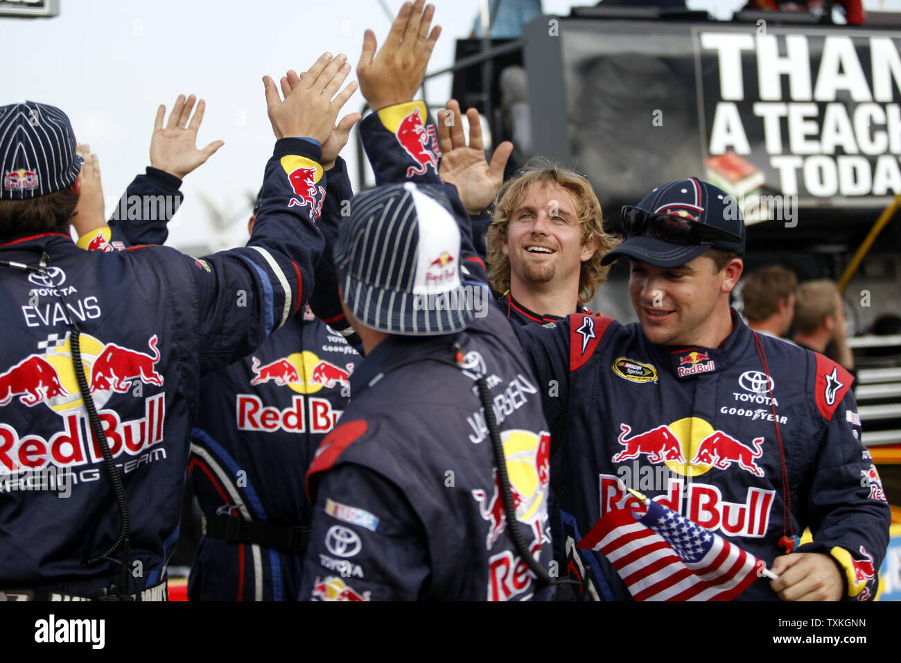 The Red Bull Toyota pit crew exchange "high fives" on pit road before ...