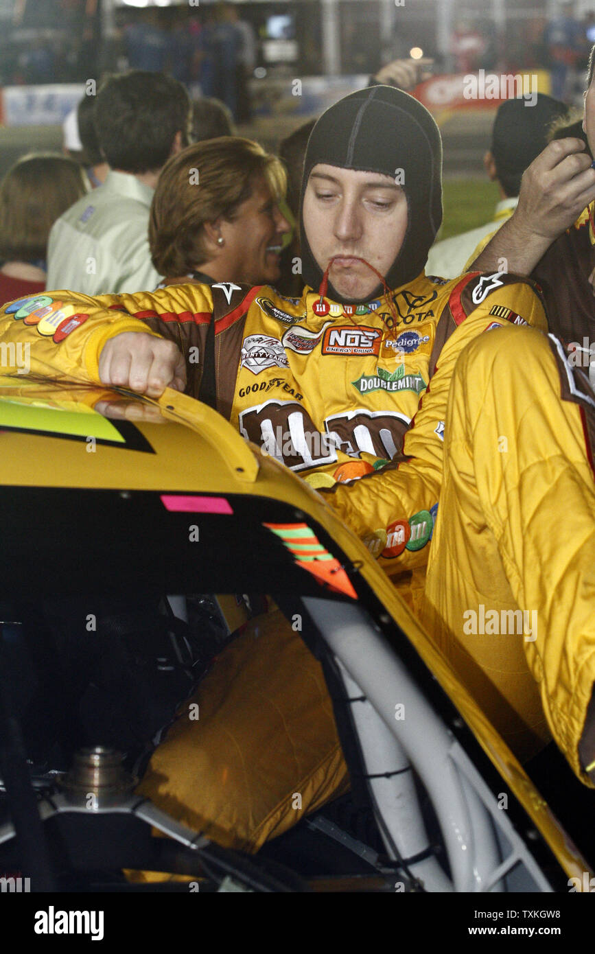 Kyle Busch climbs into his race car before the NASCAR Bank of America ...
