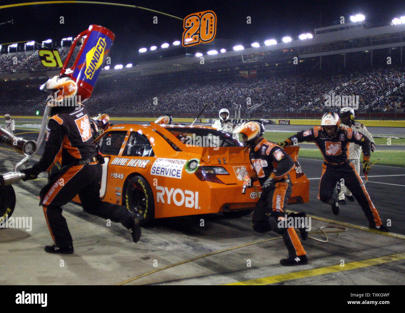 Joey Logano's crew completes a pit stop during the NASCAR Bank of ...