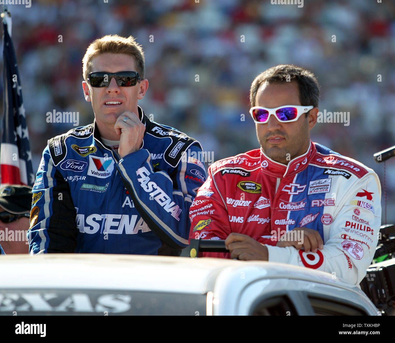 NASCAR drivers Carl Edwards, left, and Juan Pablo Montoya ride together ...
