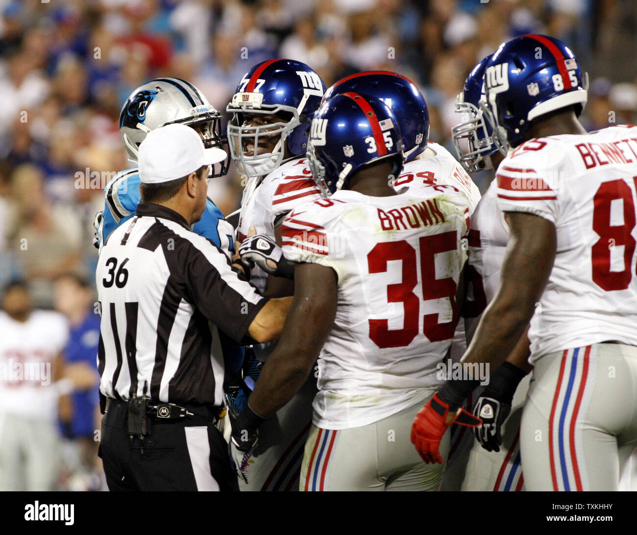Referee Robert Frazer separates players as the Carolina Panthers play ...