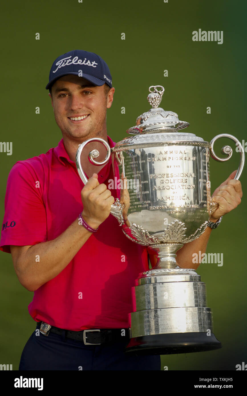 Justin Thomas holds the Wanamaker Trophy after winning the 2017 PGA ...