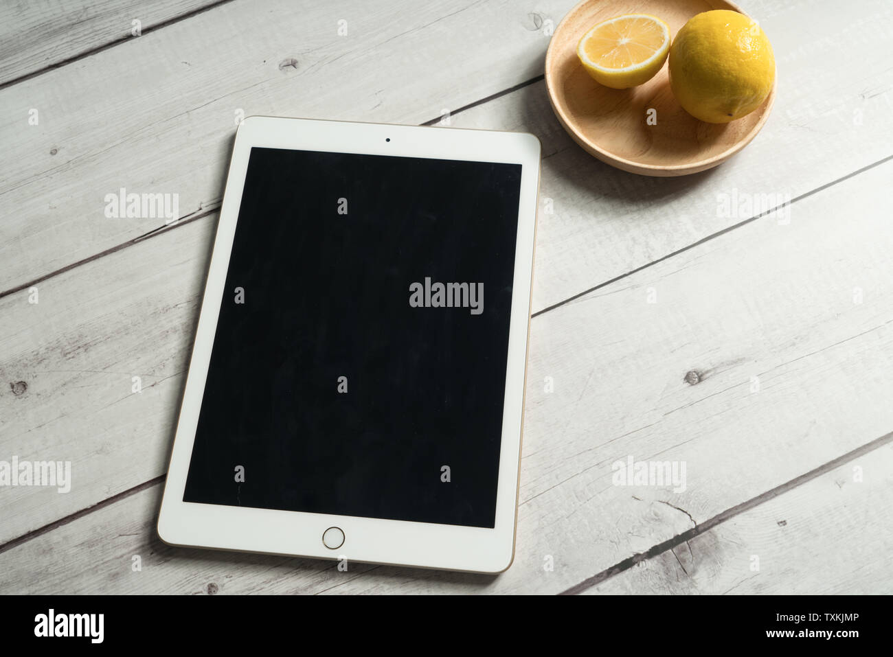 Lemon with tablet Stock Photo - Alamy