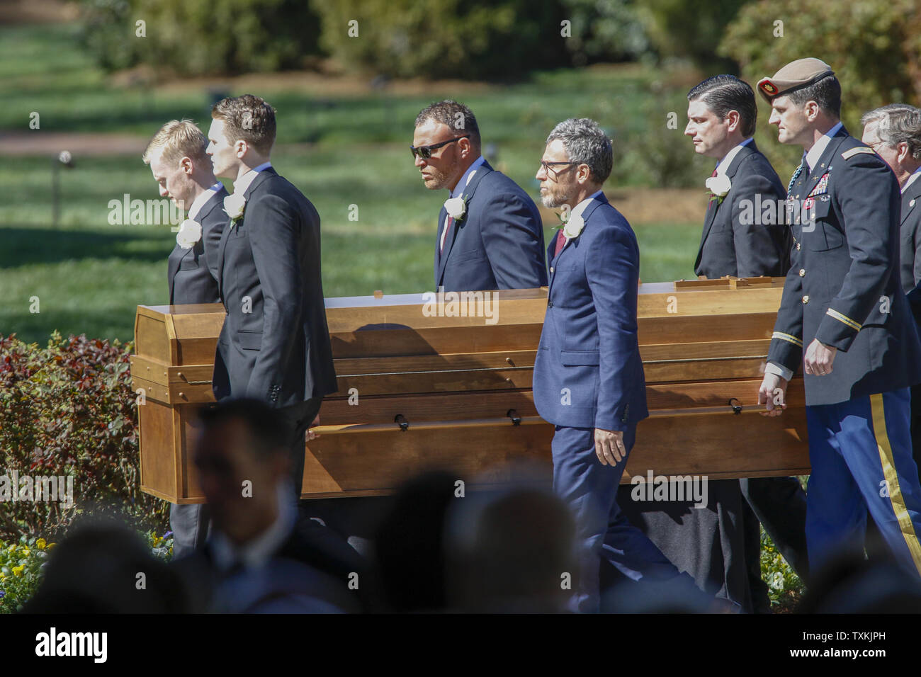 The casket of evangelist Rev. Billy Graham is carried by his grandsons ...