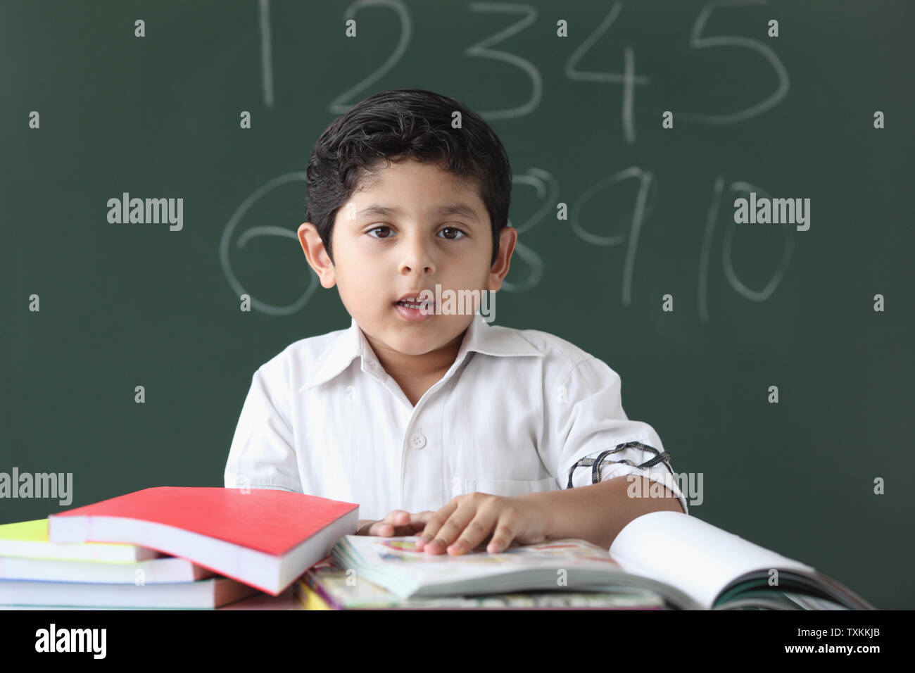 Student reading in a classroom Stock Photo - Alamy
