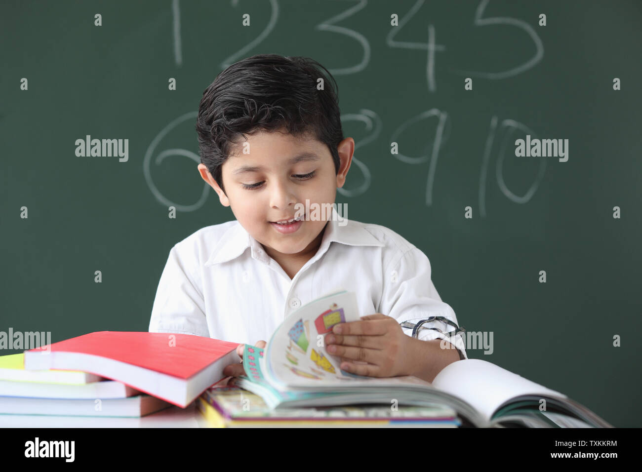 Schoolboy reading to class uniform hi-res stock photography and images ...