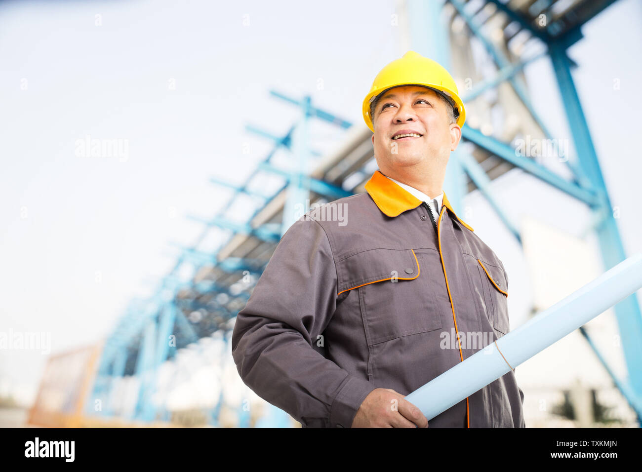 old chinese man engineer in oil refinery plant Stock Photo - Alamy