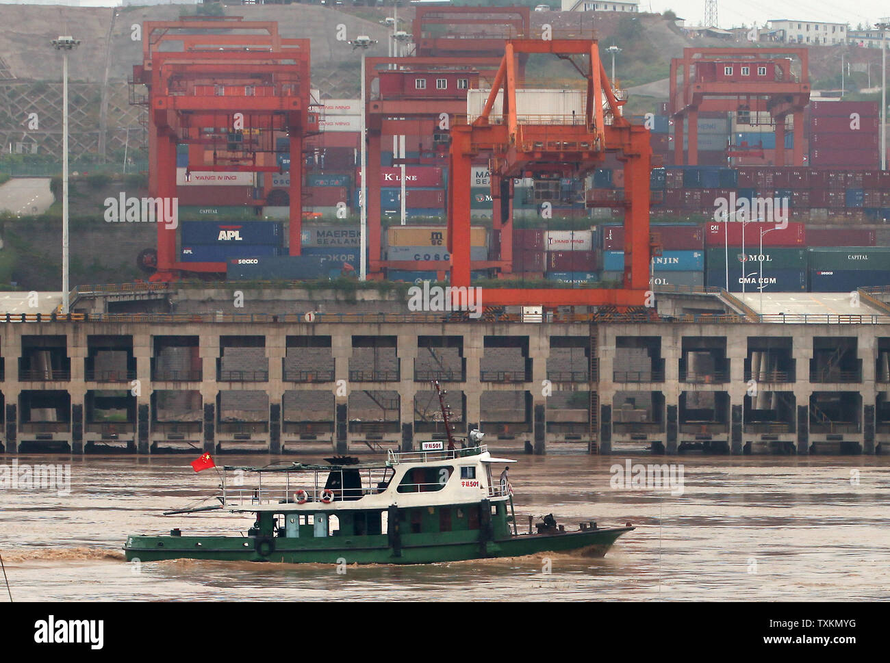 A Chinese patrol boat passes the newly built inland, deep-water ...