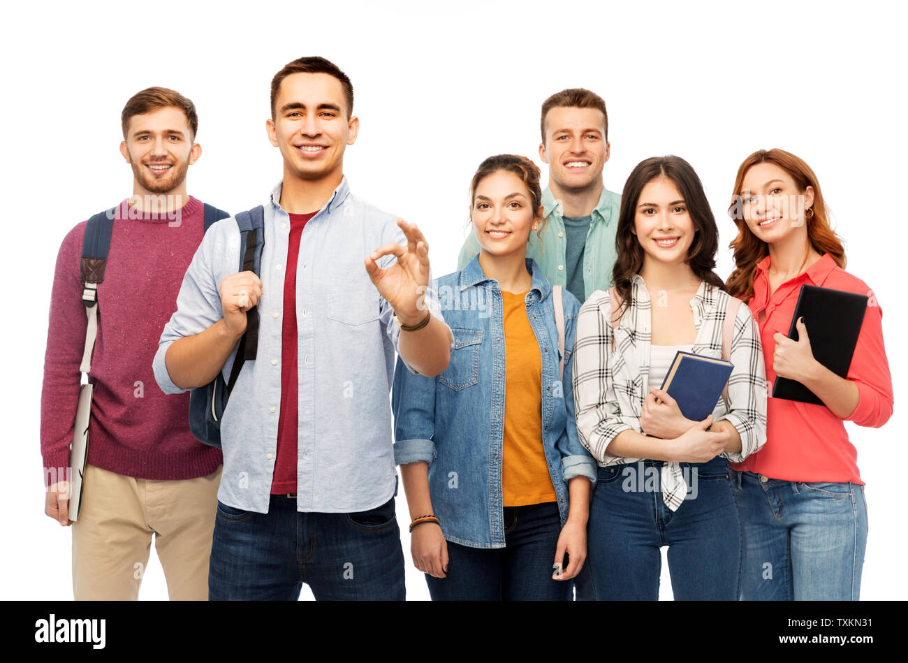 group of smiling students showing ok hand sign Stock Photo - Alamy