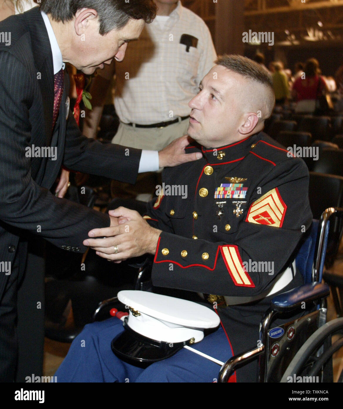 Congressman Dennis Kucinich talks with Marine Staff Sgt. Daniel ...