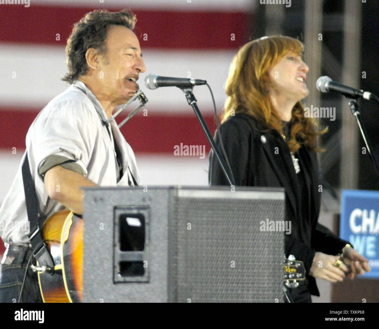 Bruce Springsteens with his wife Patti Scialfa entertains the crowd ...