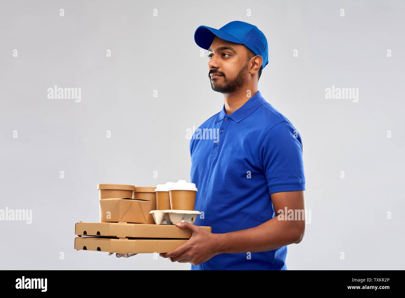 indian delivery man with food and drinks Stock Photo - Alamy