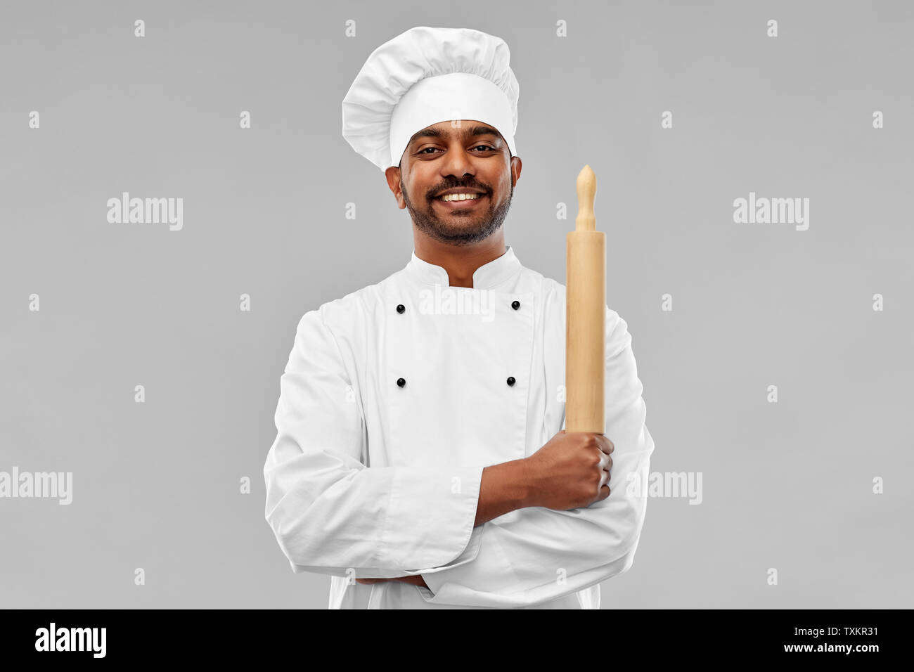 happy male indian chef or baker with rolling-pin Stock Photo - Alamy
